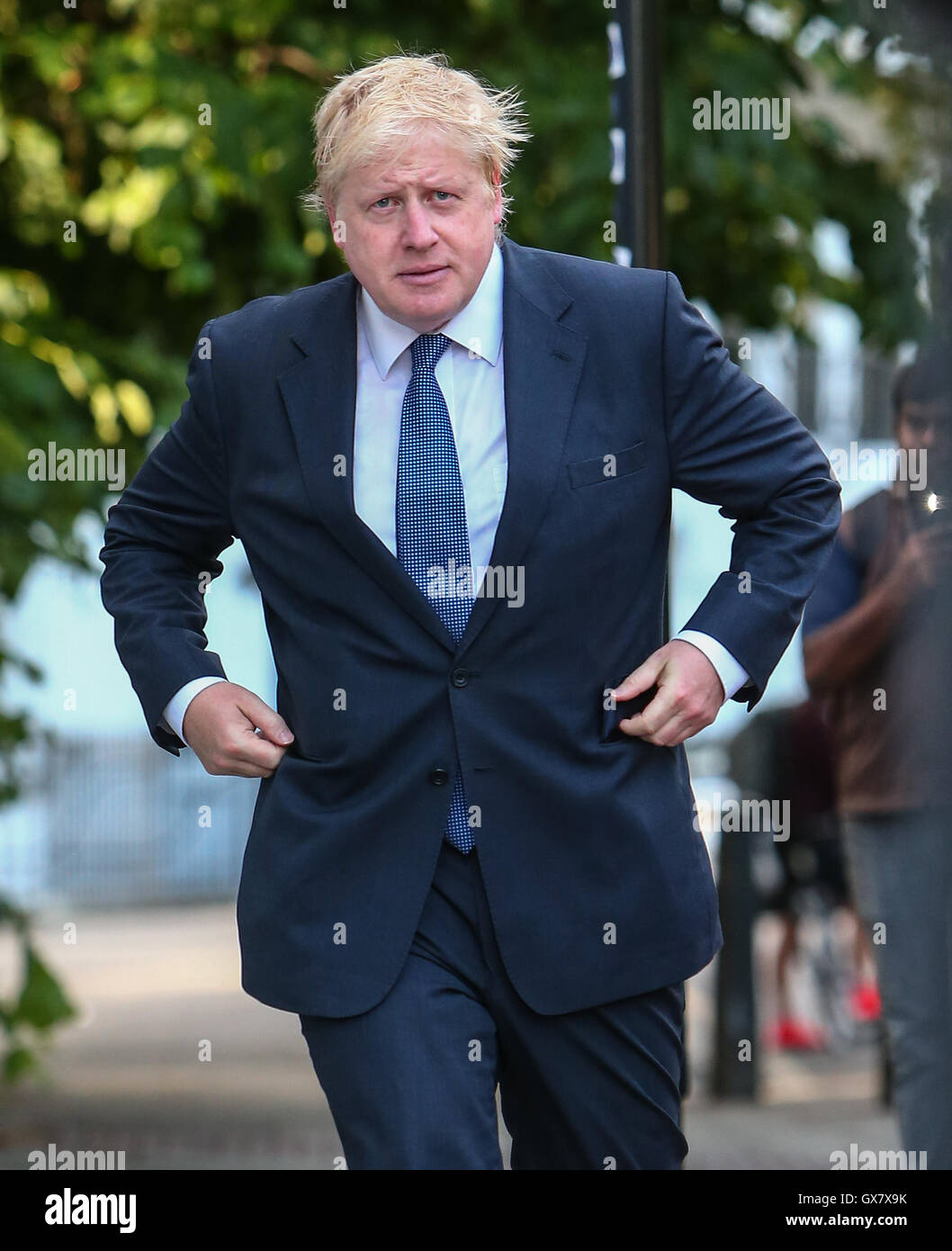 Boris Johnson MP leaves his north London home with a member of his team ...
