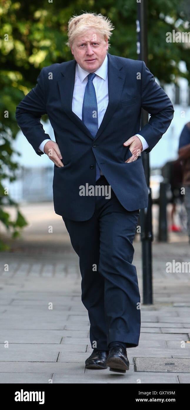 Boris Johnson MP leaves his north London home with a member of his team ...