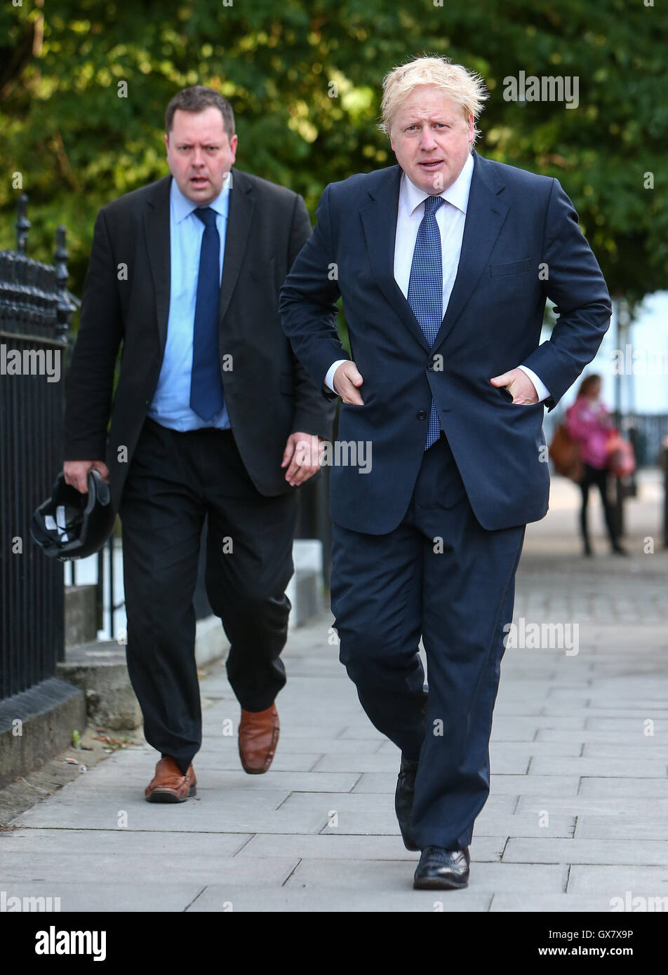 Boris Johnson MP leaves his north London home with a member of his team ...
