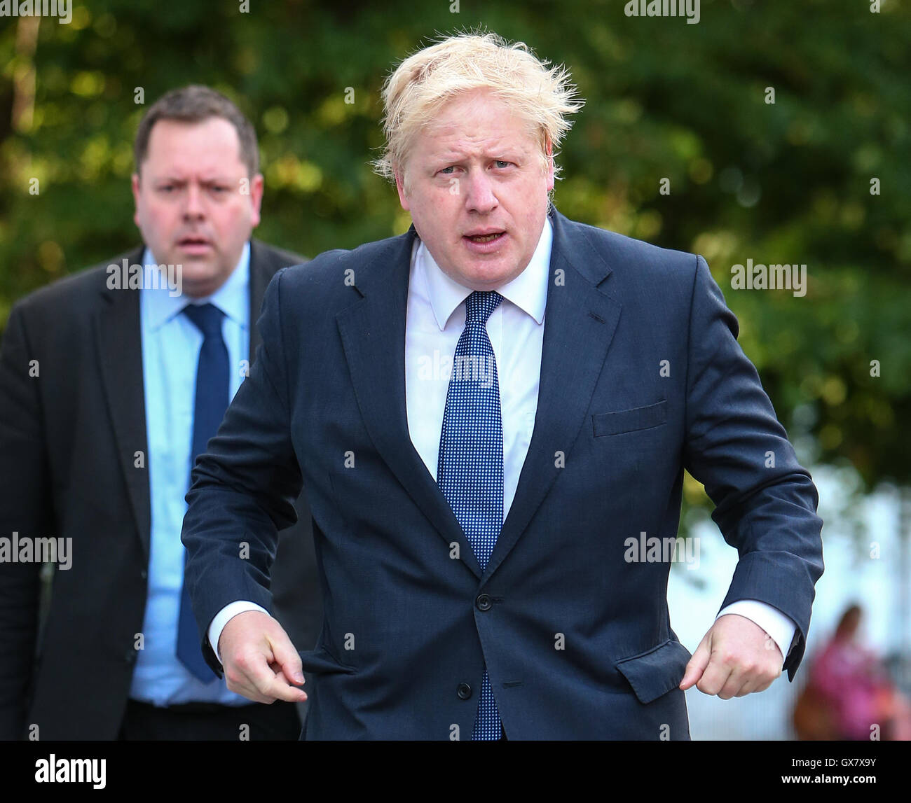 Boris Johnson MP leaves his north London home with a member of his team ...