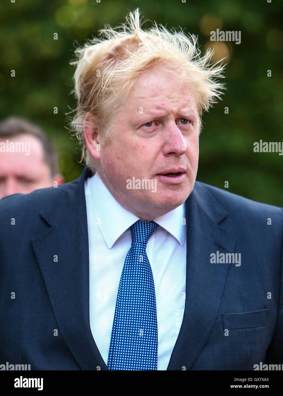 Boris Johnson MP leaves his north London home with a member of his team ...