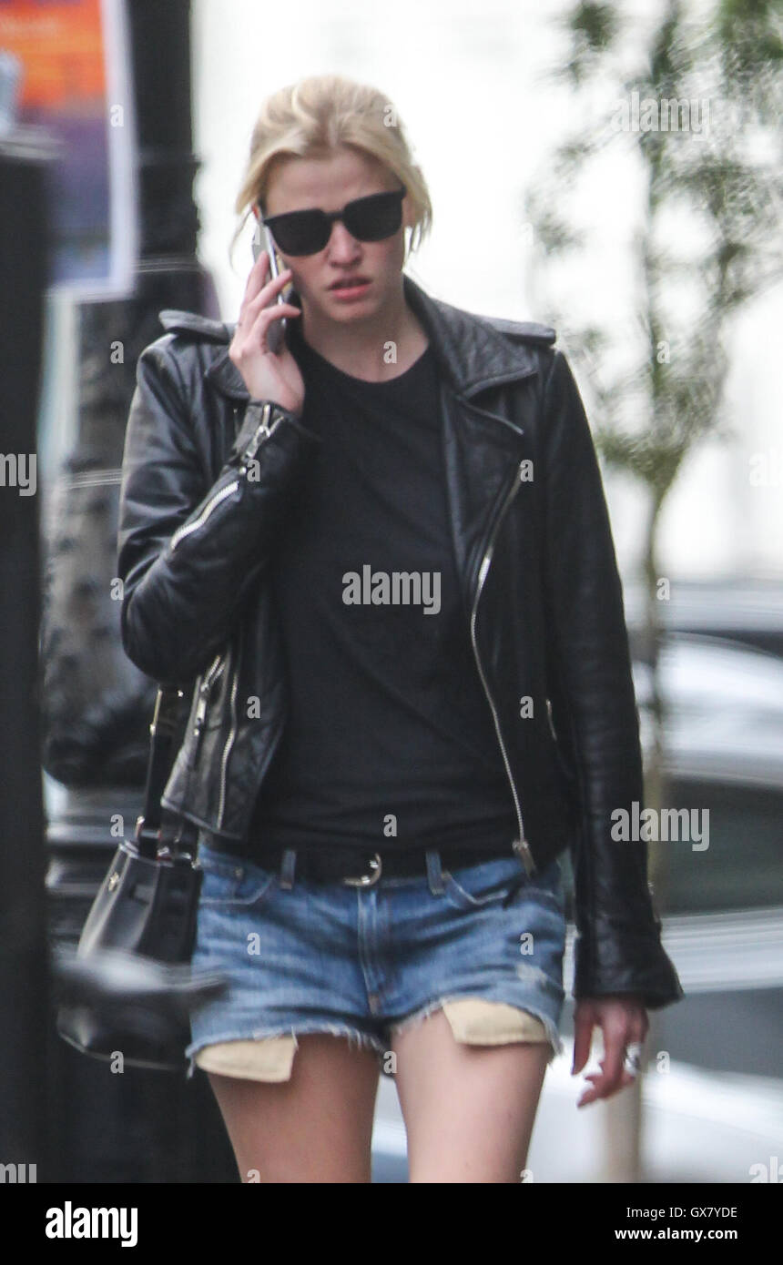 Lara Stone looks pensive whilst talking on her phone. She was walking ...