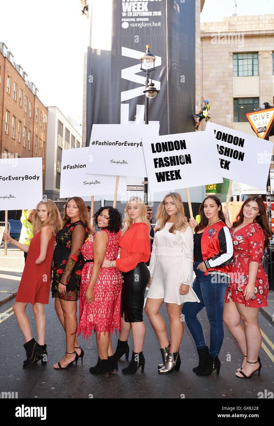 A group of seven models of various shapes and sizes, protest outside ...