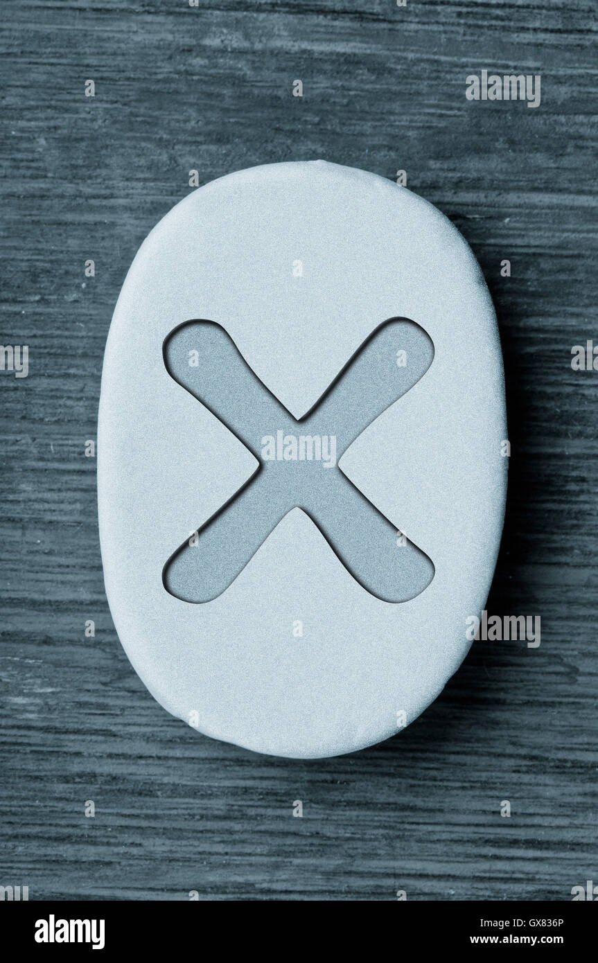 rune symbol Gebo on stone Stock Photo - Alamy