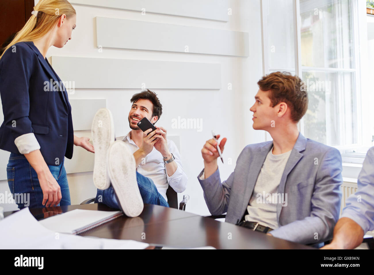 Business people during break in start-up company Stock Photo - Alamy