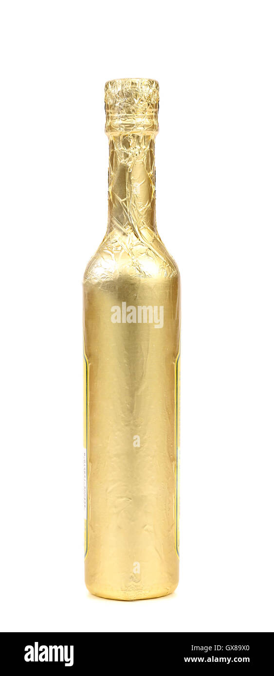 Bottle wrapped with gold foil Stock Photo - Alamy