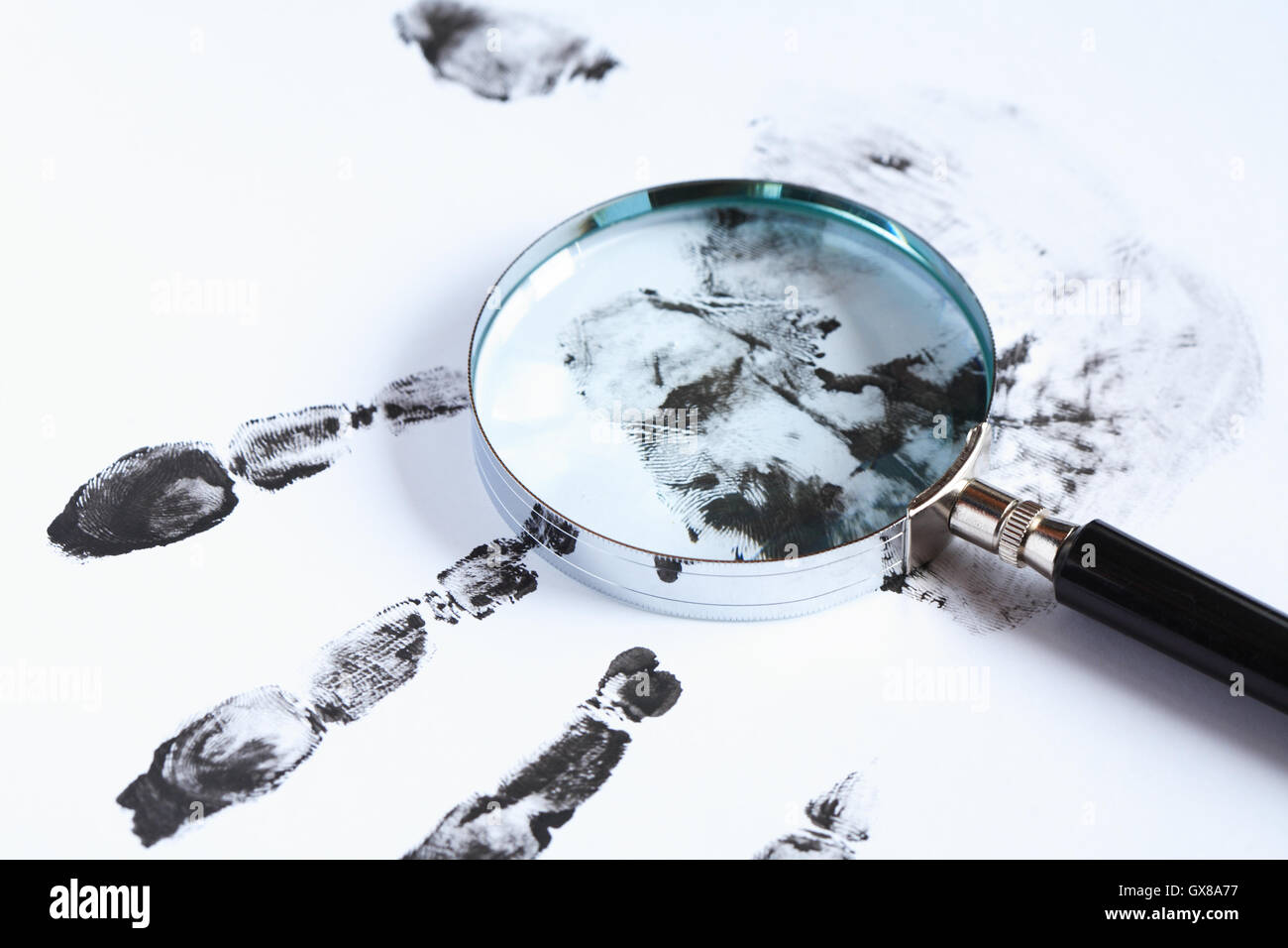 Fingerprints And Magnifying Glass Stock Photo - Alamy