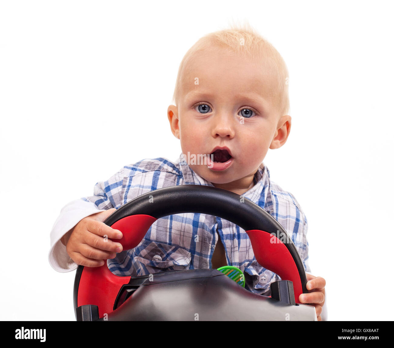 Little boy holding a toy steering wheel over white Stock Photo - Alamy