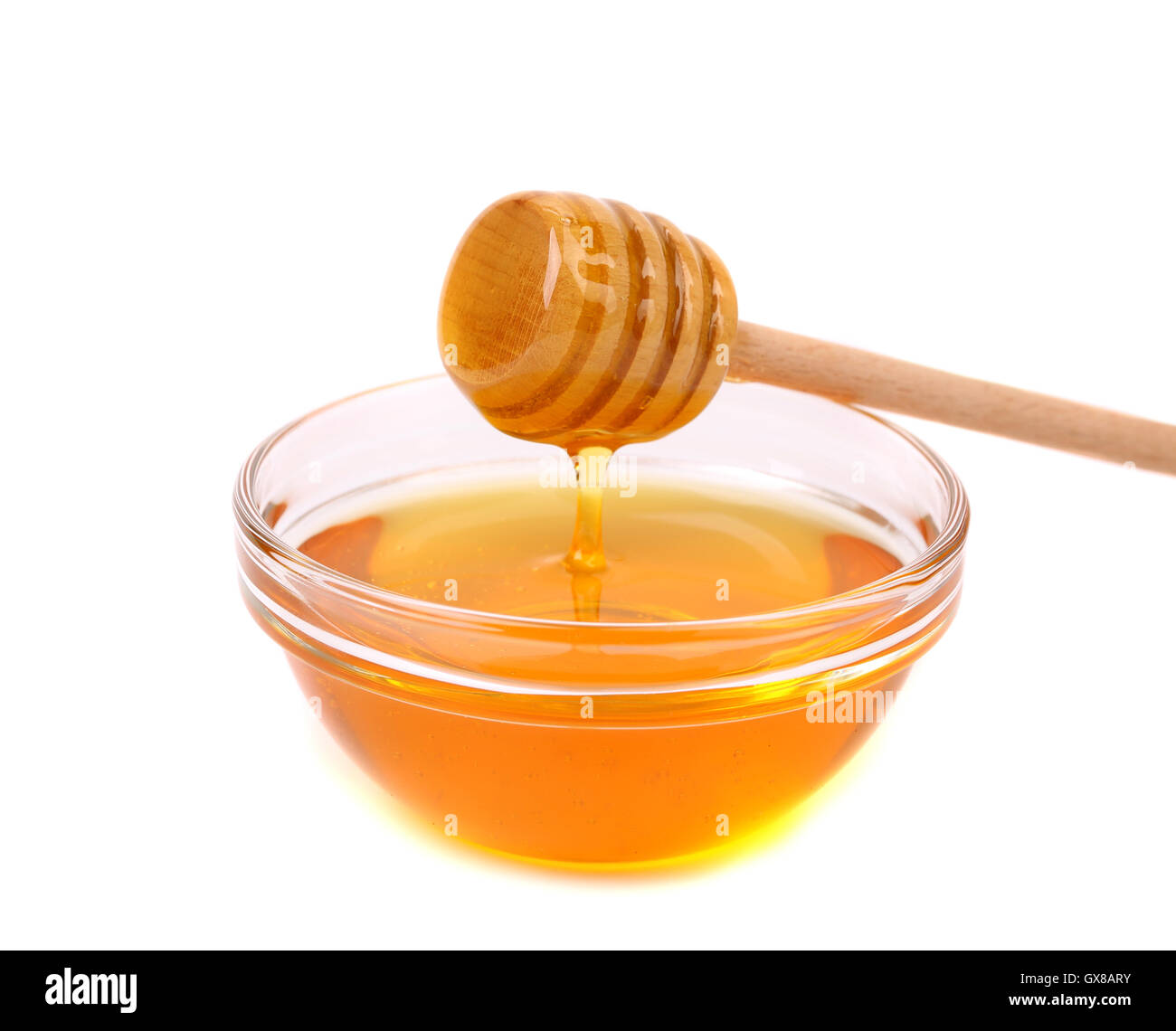 Bow of honey and wooden spoon Stock Photo - Alamy