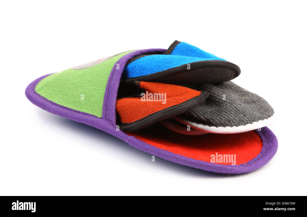 Four small slippers inside a big Stock Photo - Alamy