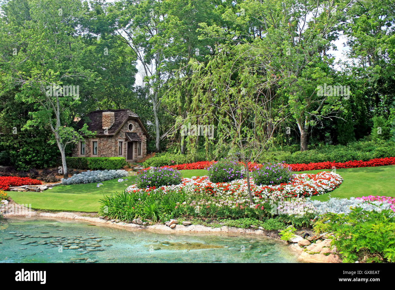 A beautiful garden with a little house Stock Photo - Alamy