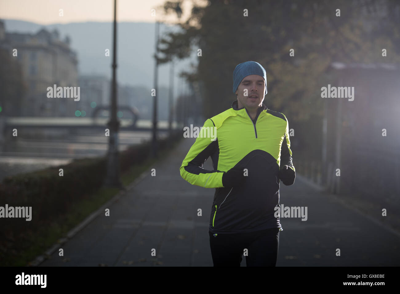 man jogging at cold autumn mornigng Stock Photo - Alamy