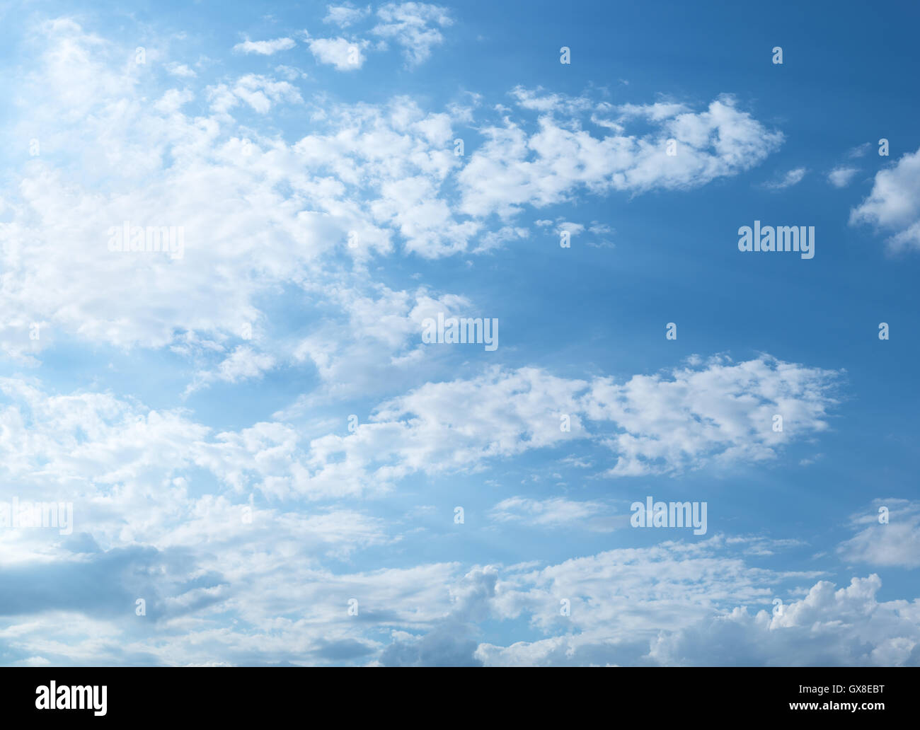 Blue sky and puffy clouds Stock Photo - Alamy