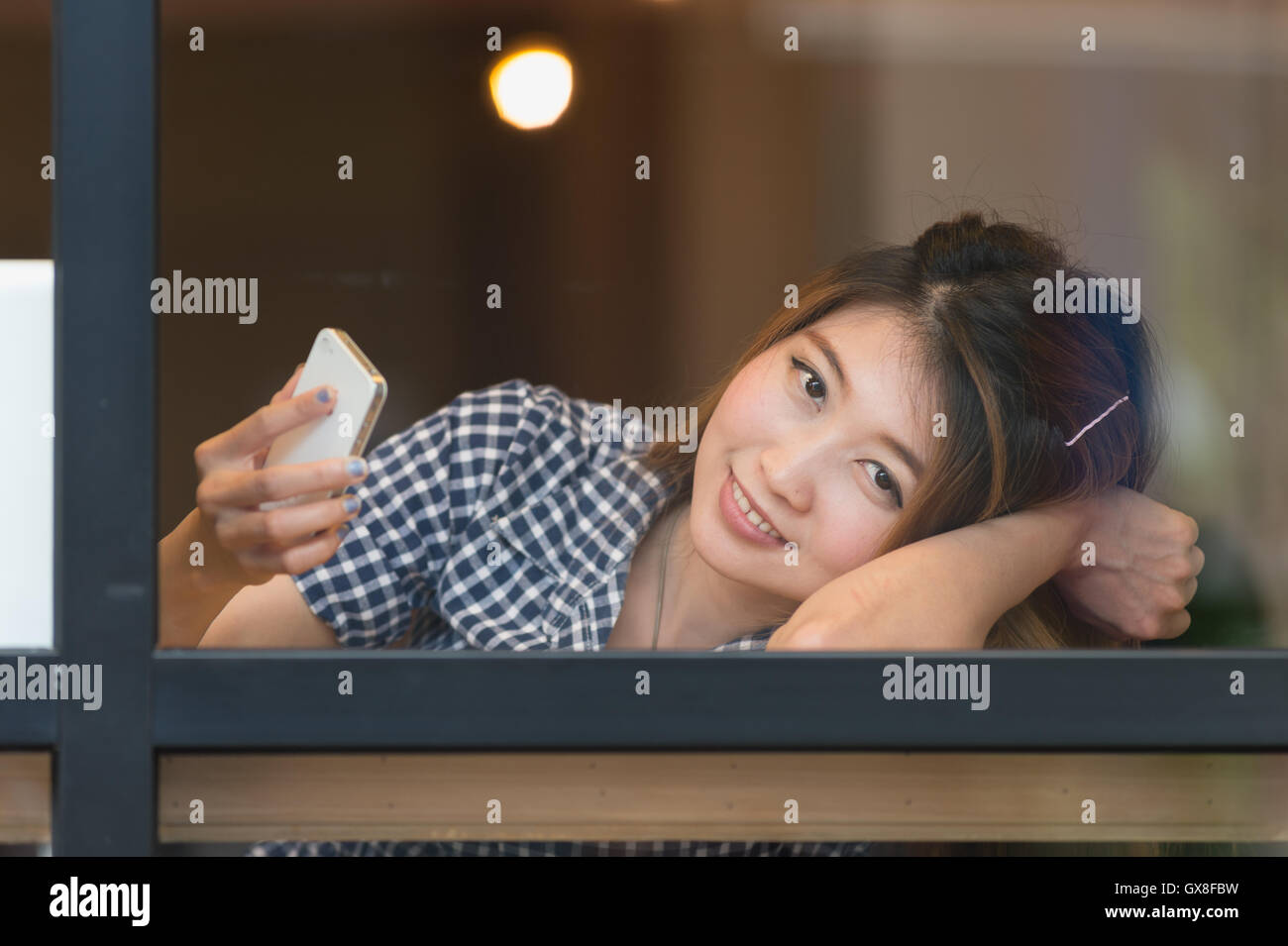 Woman texting talking sitting hi-res stock photography and images - Alamy