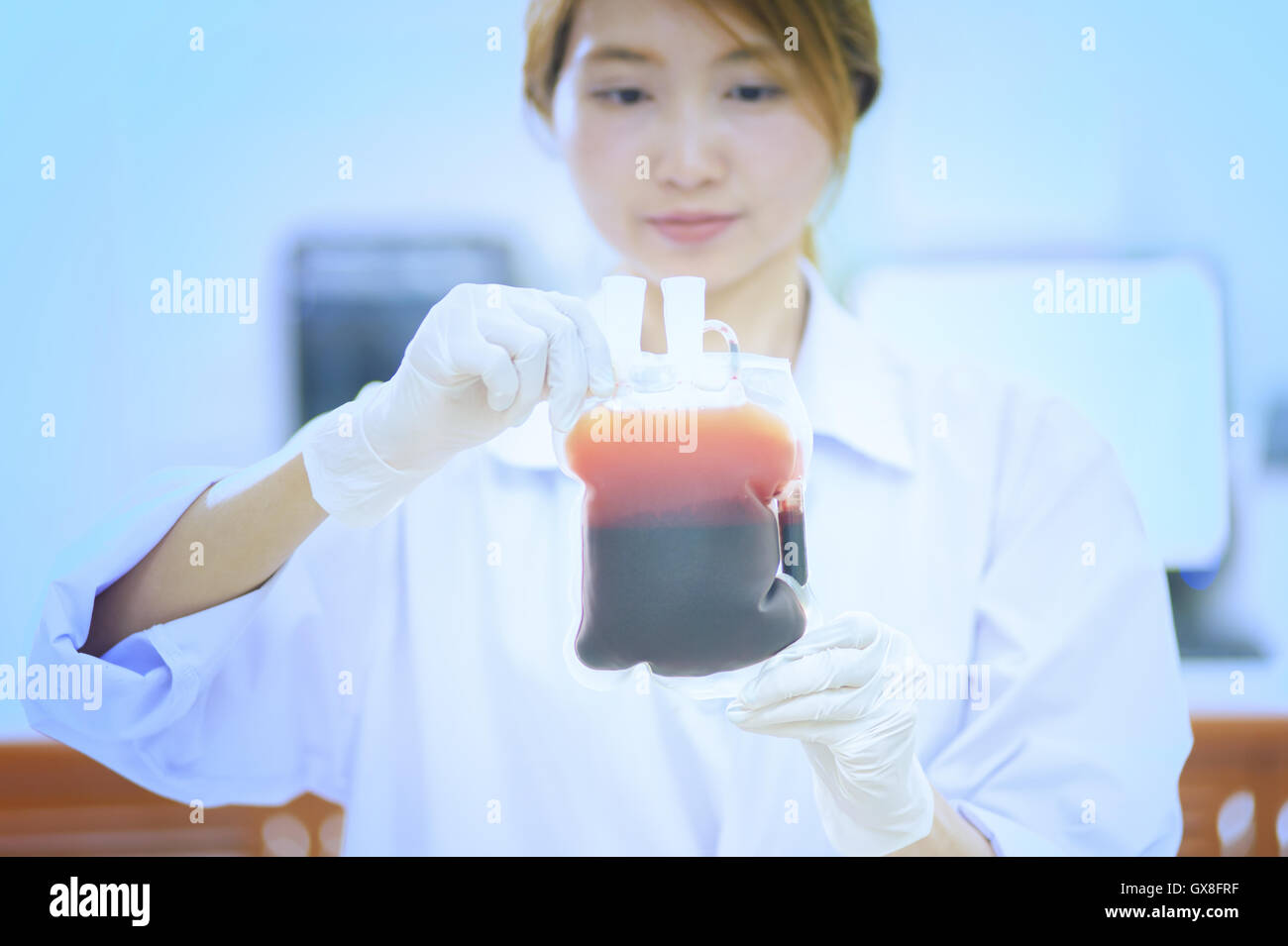 Bag of Blood in hand asian woman Doctor Stock Photo - Alamy