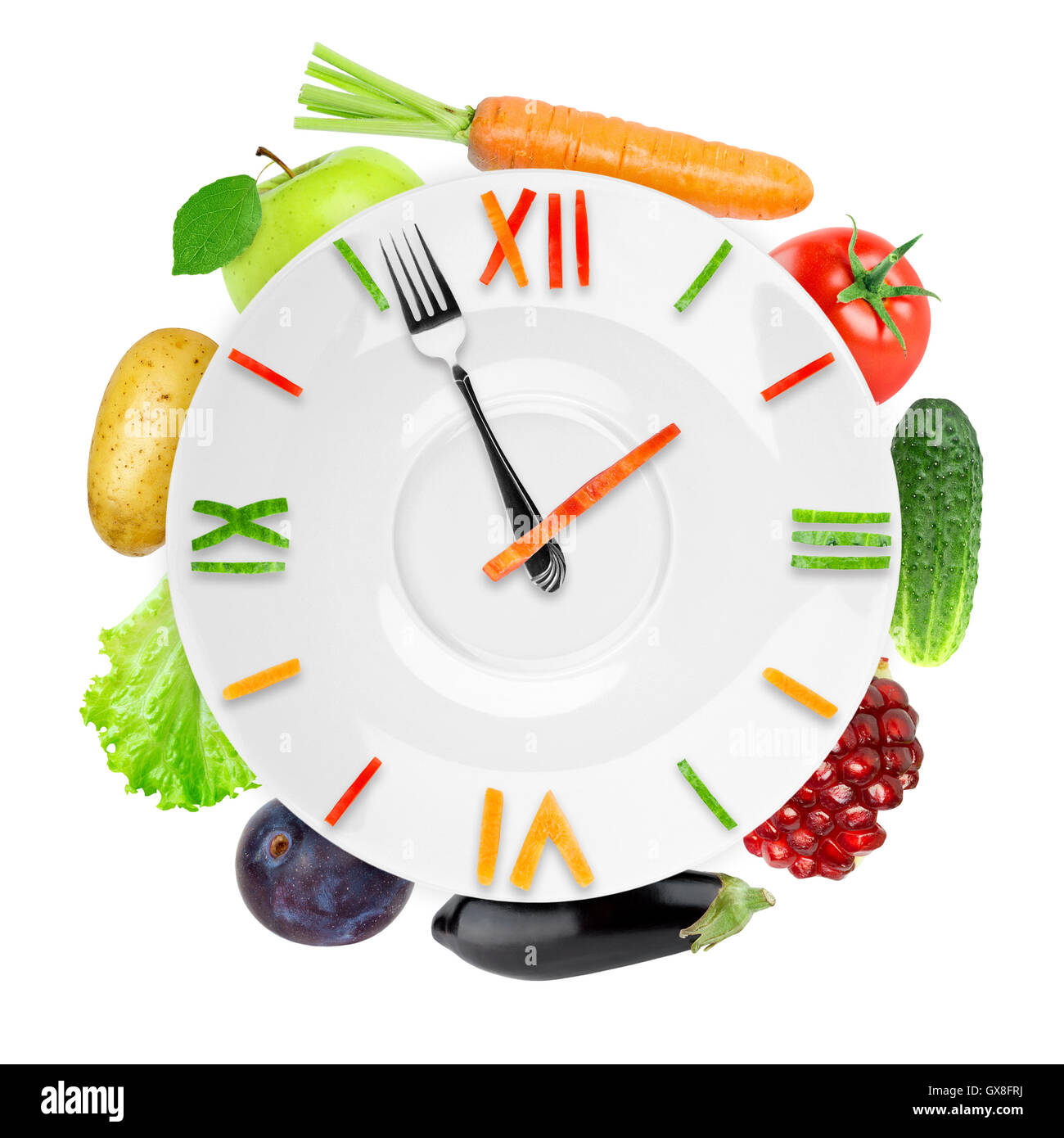 Food clock with fruits and vegetables on white background Stock Photo ...