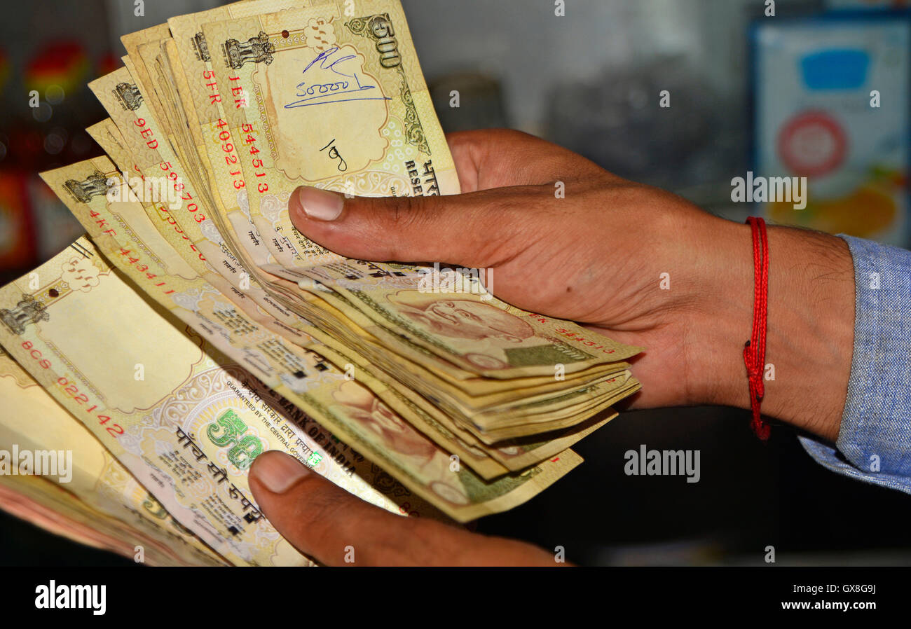 Cash in Hand Stock Photo - Alamy