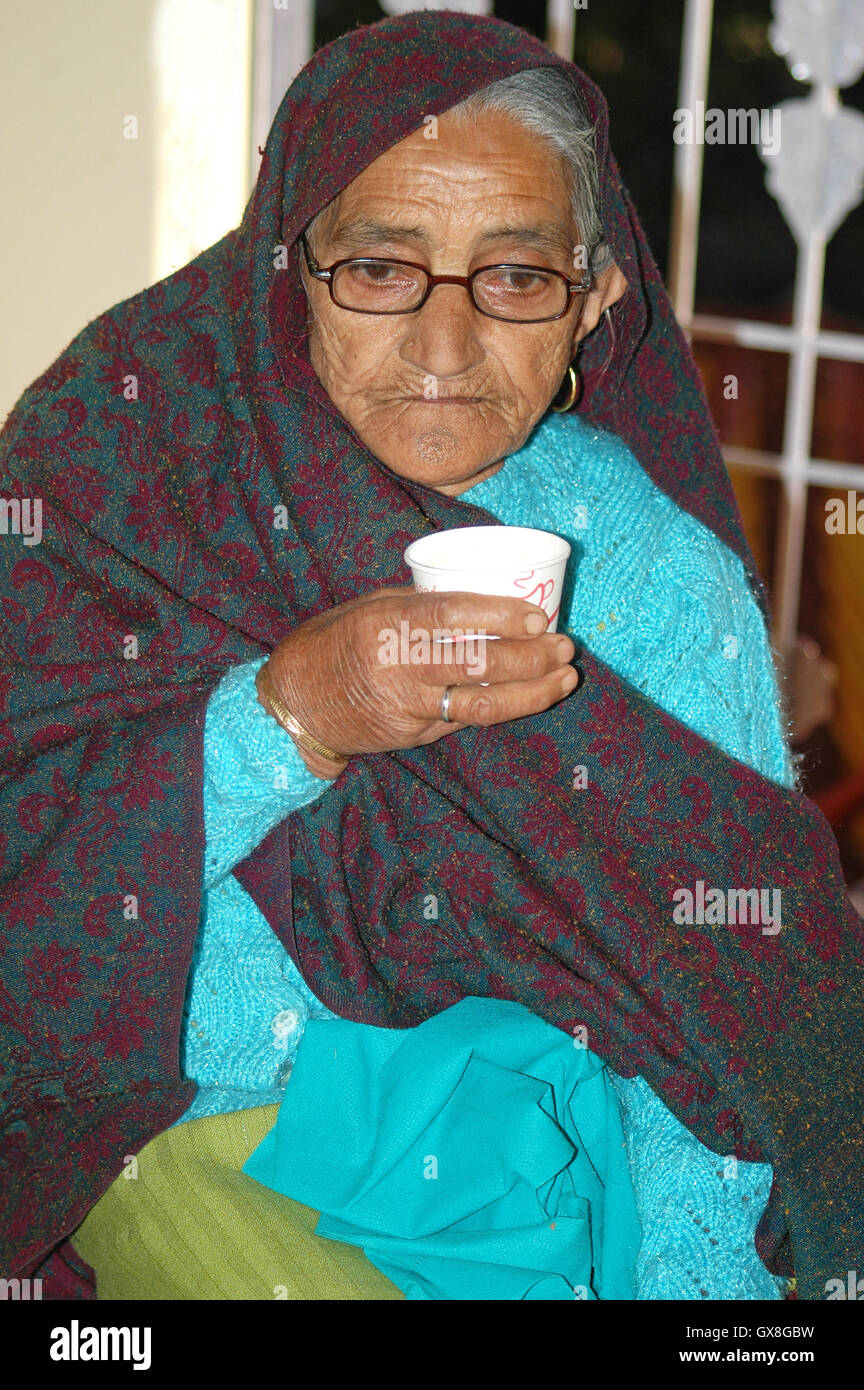 Beautiful elderly lady drinking tea Stock Photo - Alamy