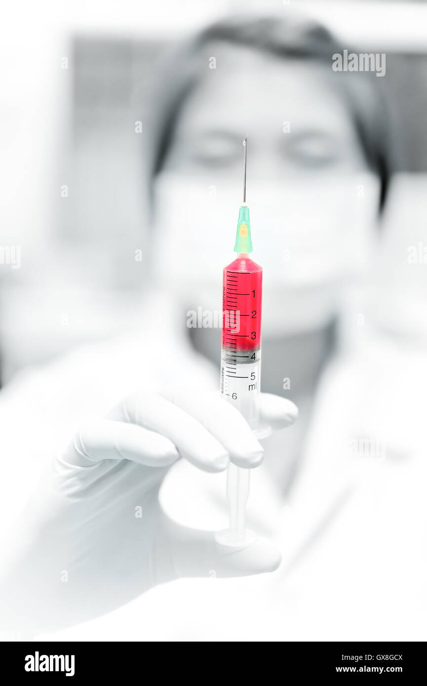 doctor using a syringe Stock Photo - Alamy