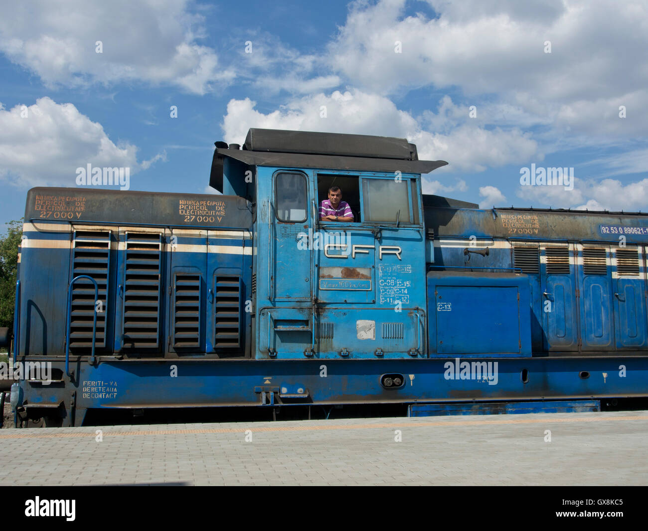 Old locomotive in a run down train station under renovation with ...