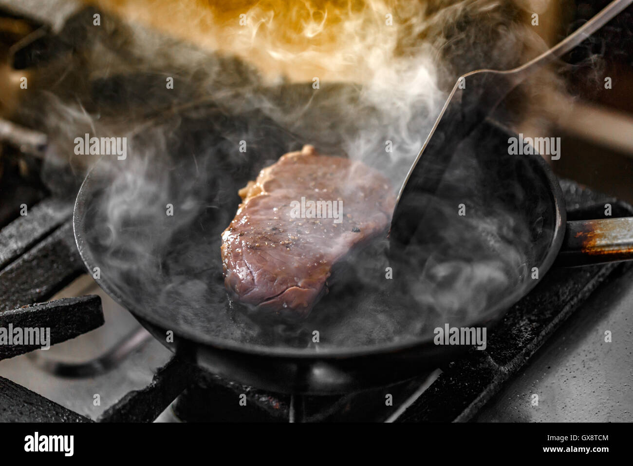 Frying beef steak in pan hi-res stock photography and images - Alamy