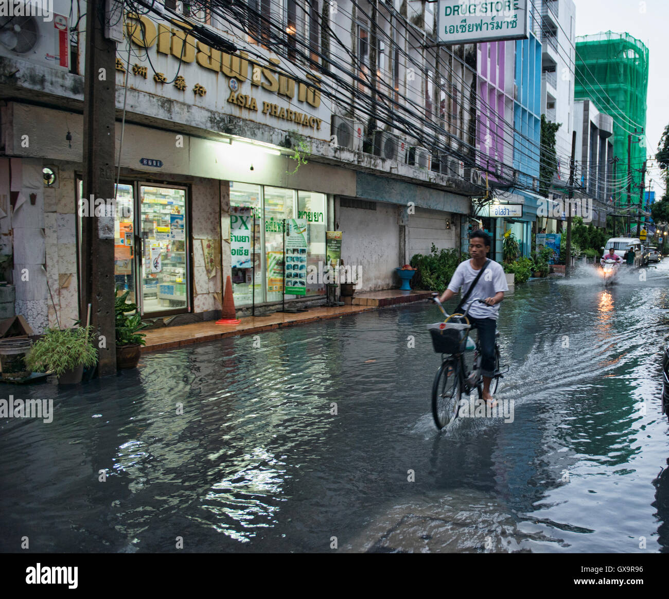 Riding through the flood, Bangkok, Thailand Stock Photo - Alamy