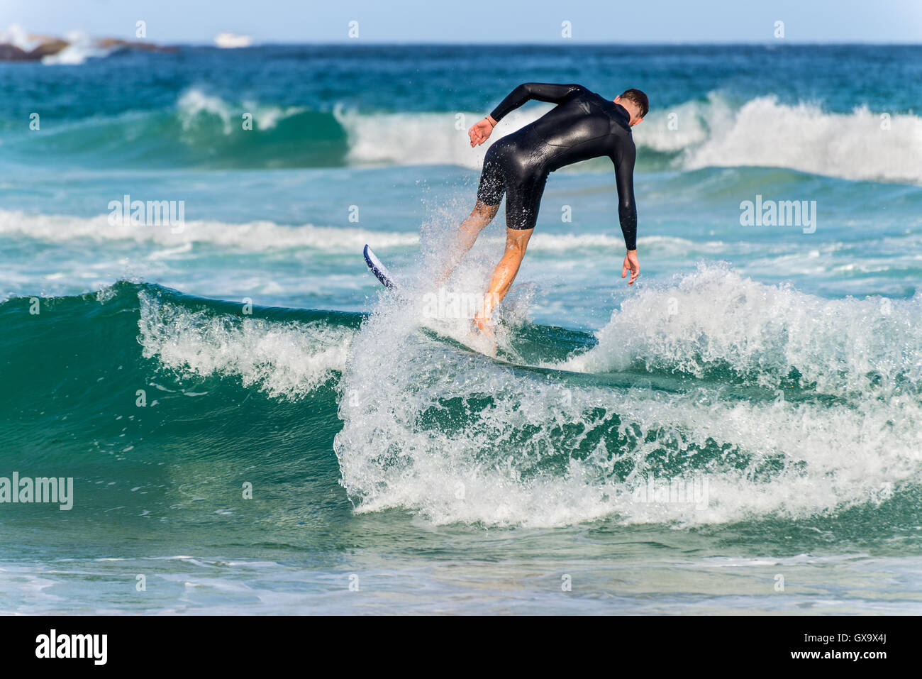 A Australian surfer catching a wave, Bondi Beach in the Eastern Suburbs ...