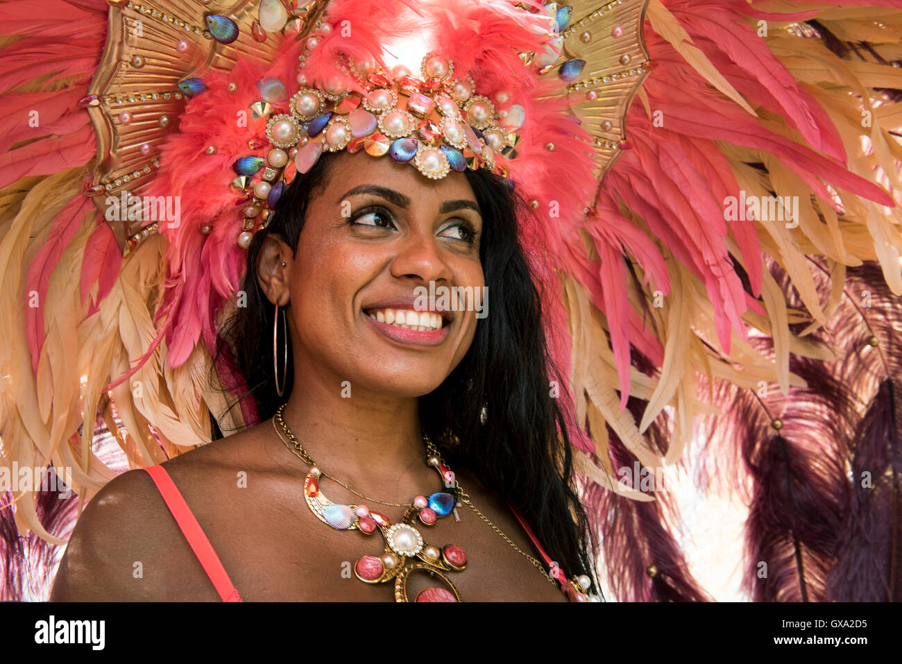 Smiling reveller at Notting Hill Carnival Stock Photo - Alamy