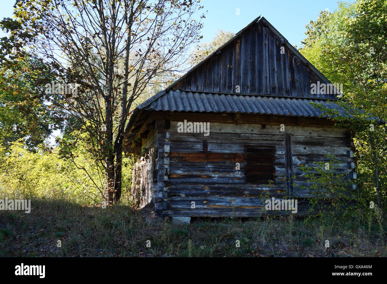 Autumn landscape. Old abandoned village on the empty field ...