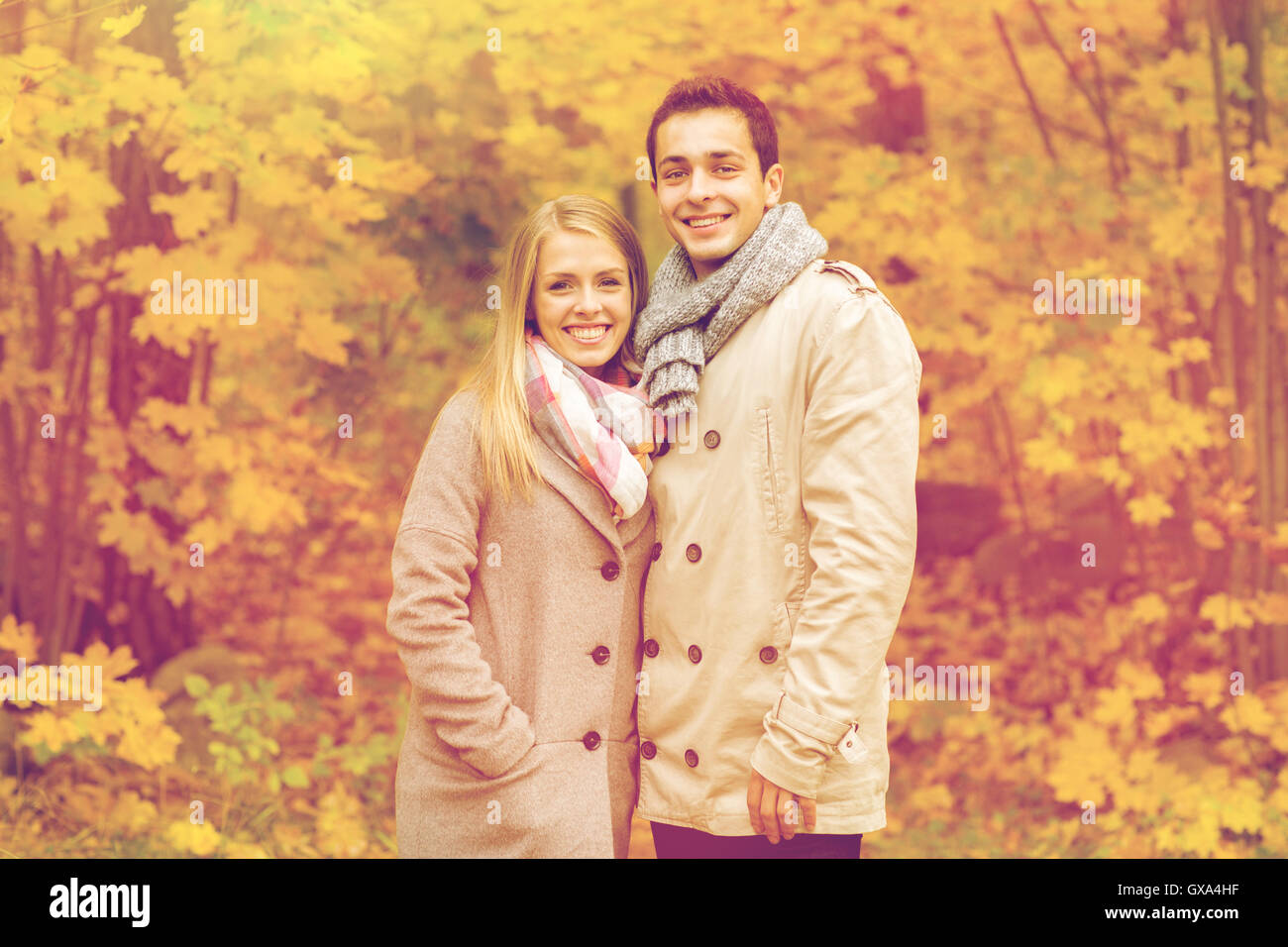 smiling couple hugging in autumn park Stock Photo - Alamy