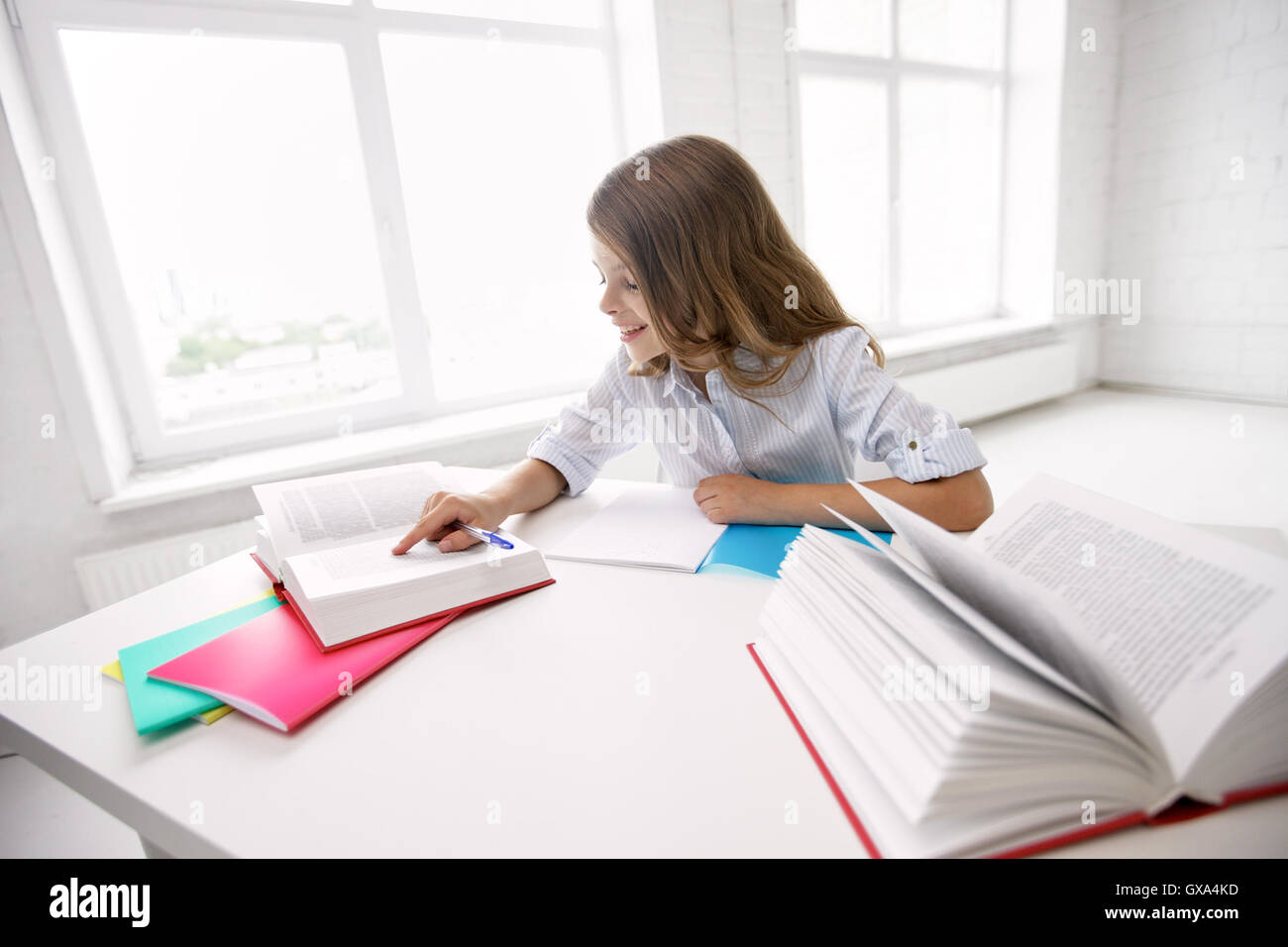 happy smiling school girl with books and notebook Stock Photo - Alamy