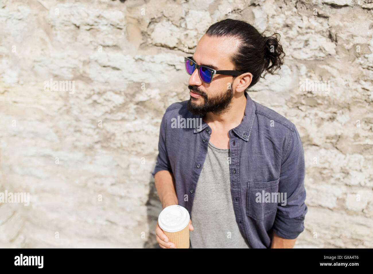 man drinking coffee from paper cup on street Stock Photo - Alamy