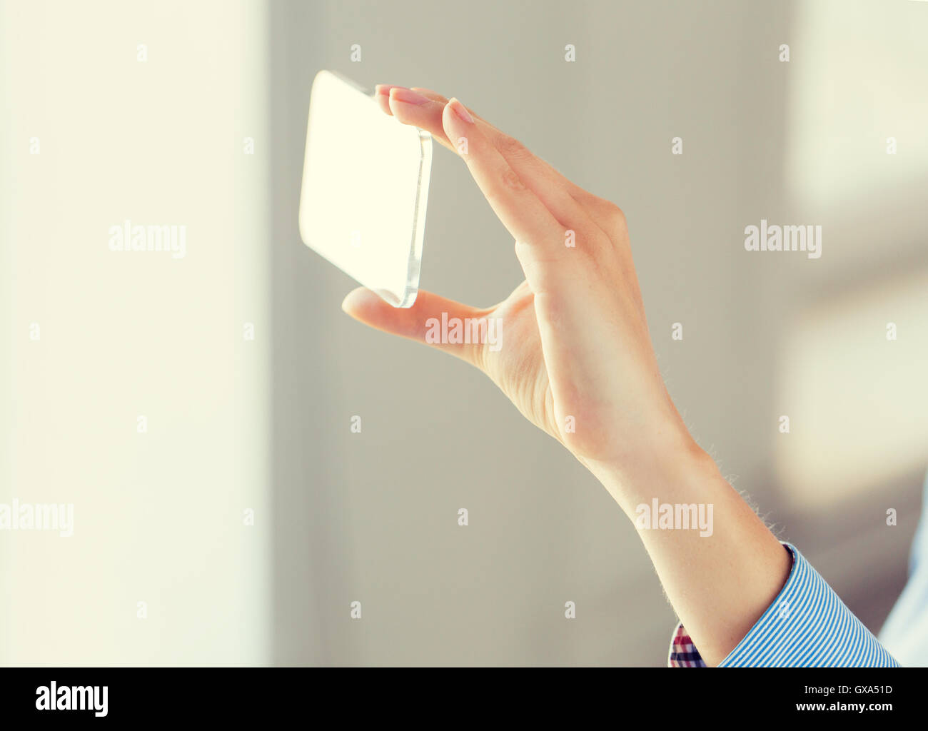 close up of woman with transparent smartphone Stock Photo - Alamy