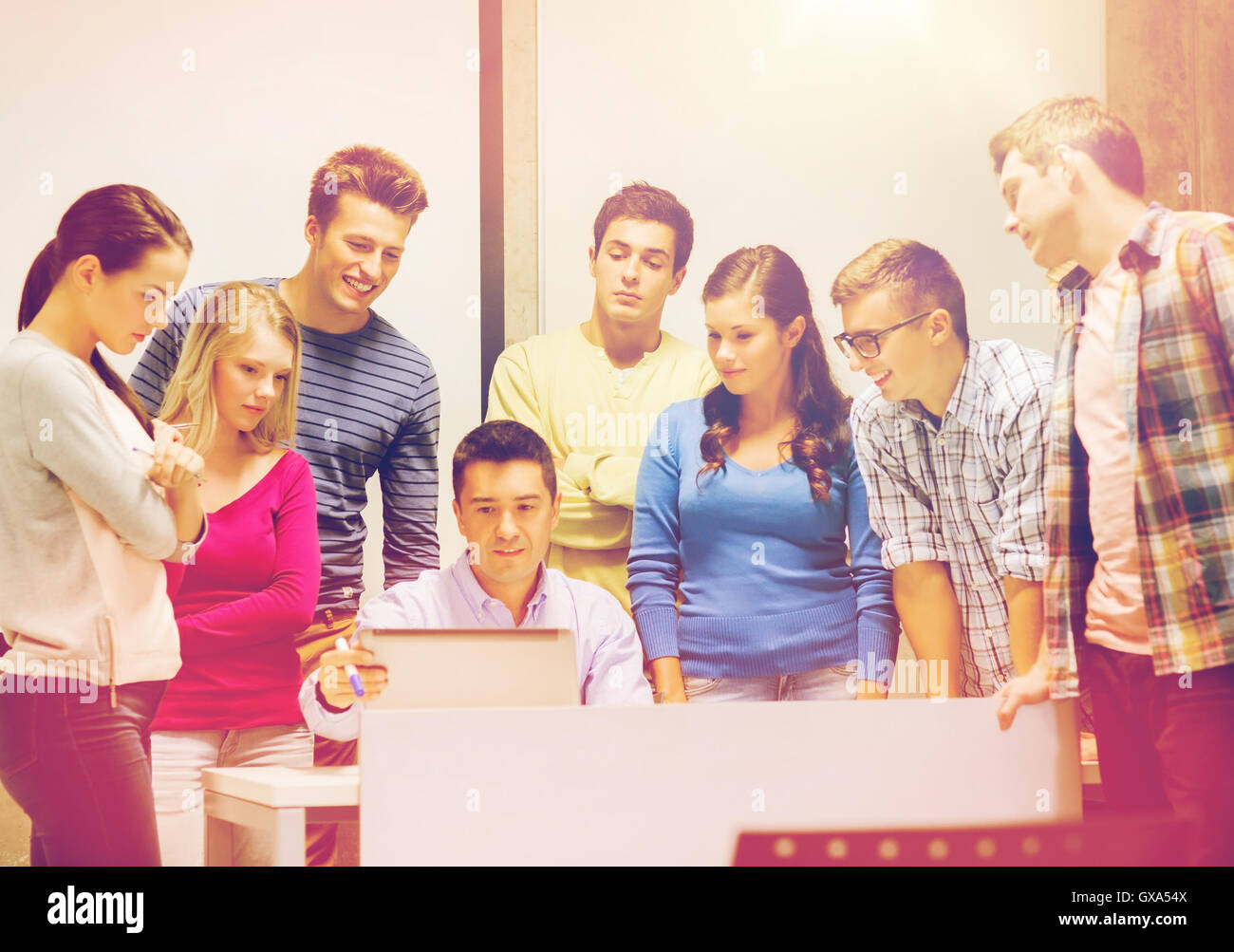 group of students and teacher with laptop Stock Photo - Alamy