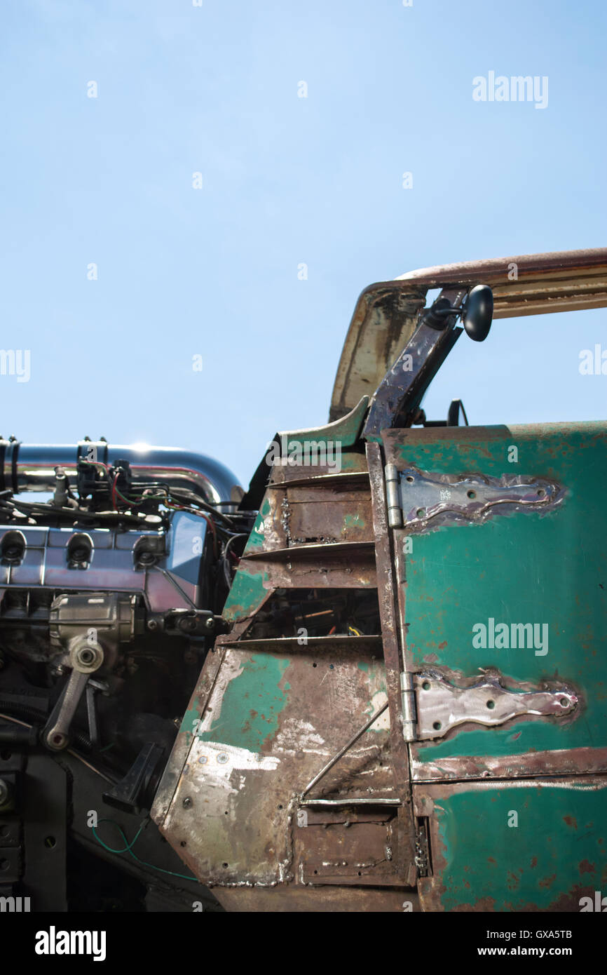 Old beat up street rod with shiny engine Stock Photo - Alamy