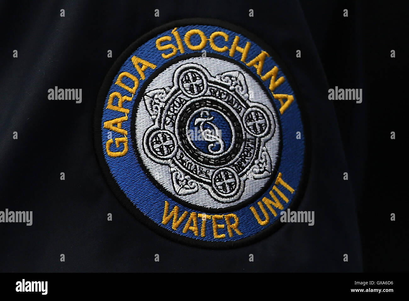 A Garda Water Unit badge on an officer attending the funeral of Coast ...
