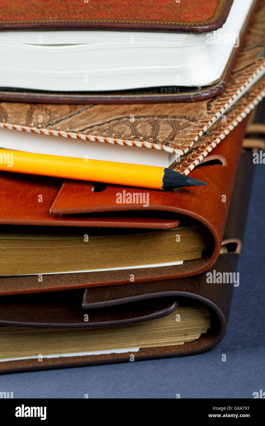 Pile of notebooks pencil hi-res stock photography and images - Alamy