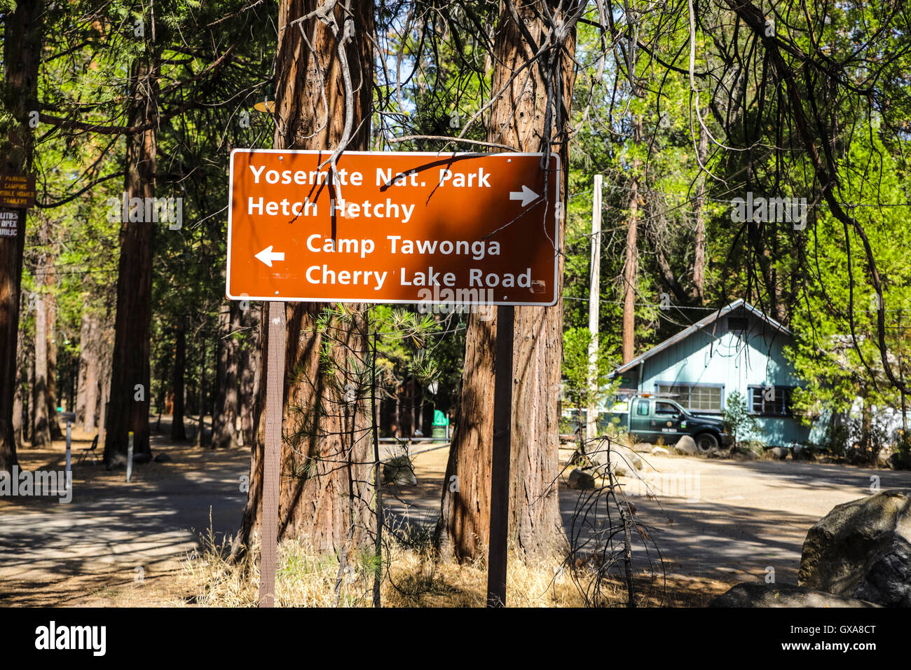 A sign at Camp Mather pointing the way to Yosemite, Hetch Hetchy and ...