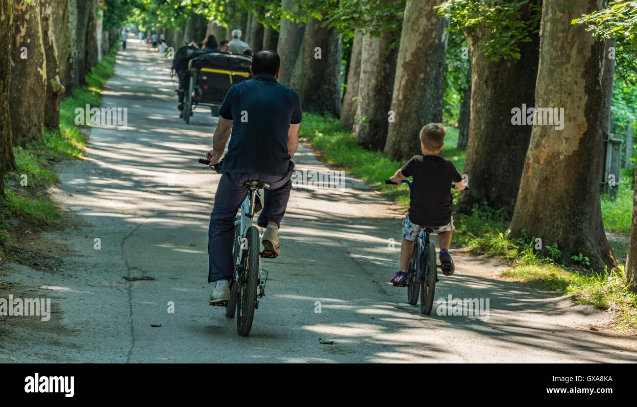 Biking over the alley Stock Photo - Alamy
