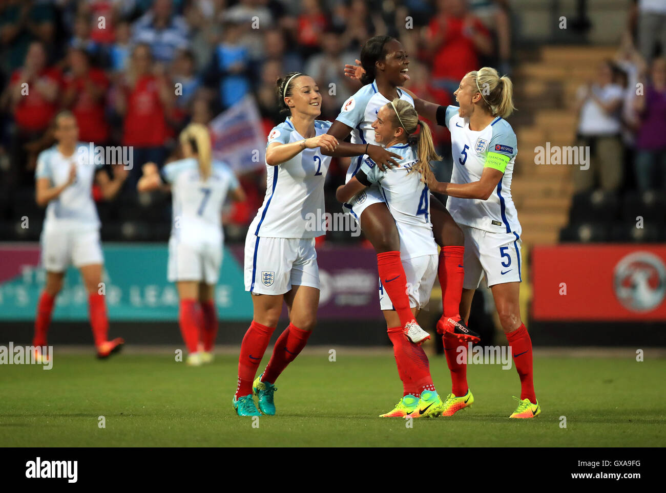 England's Danielle Carter (top) celebrates the opening goal with team ...