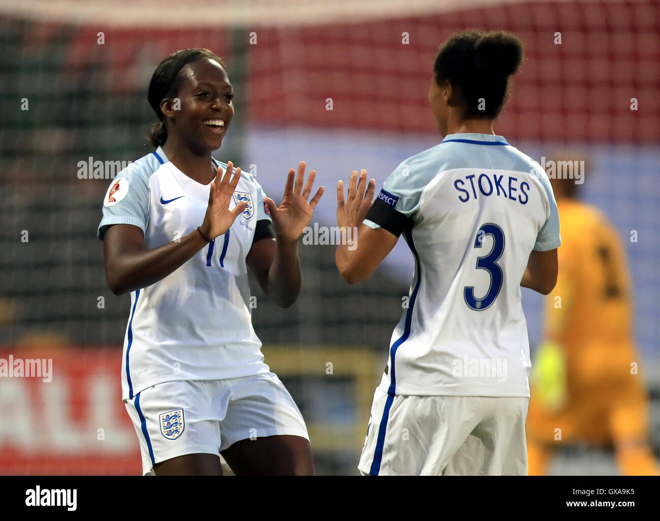 England's Danielle Carter (left) celebrates the third goal with team ...