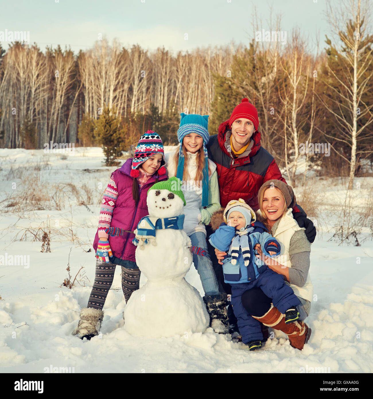 family with snowman Stock Photo - Alamy