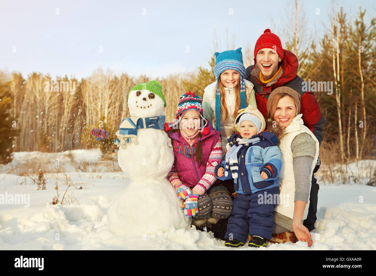 family with snowman Stock Photo - Alamy
