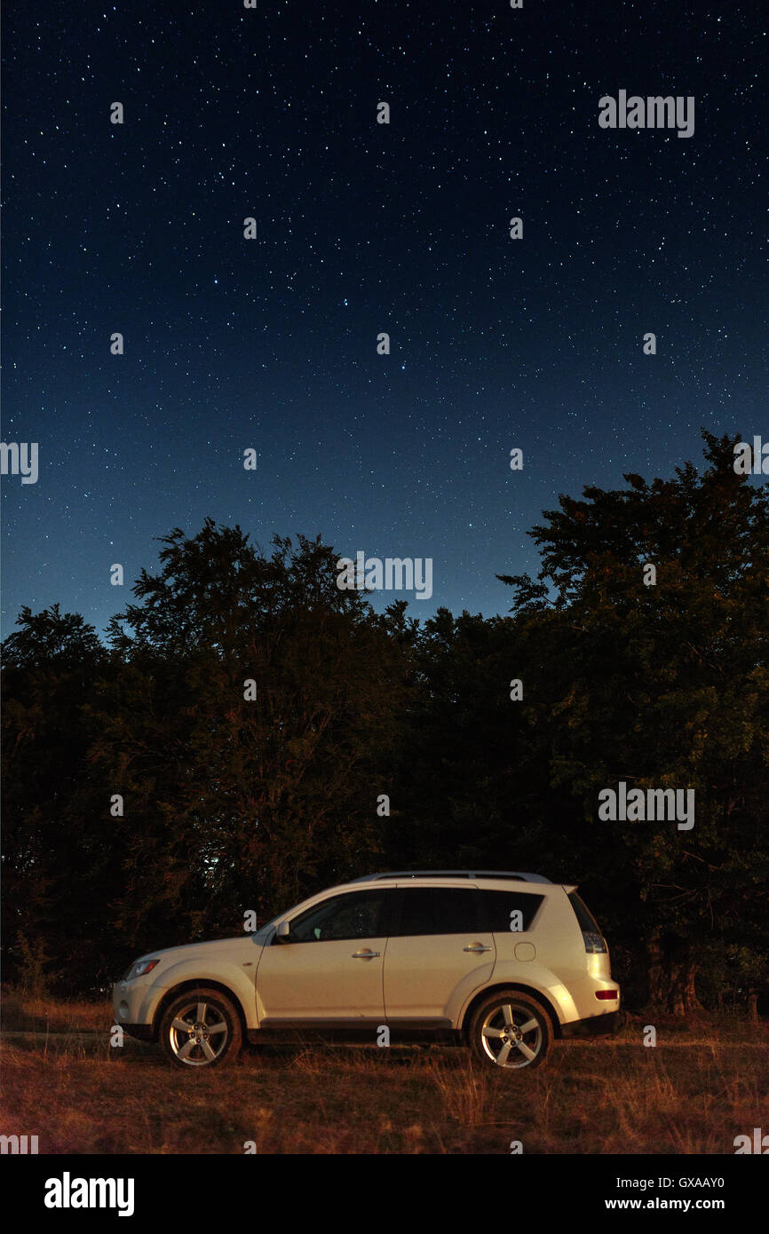 4x4 car at night under the stars near the forest Stock Photo - Alamy