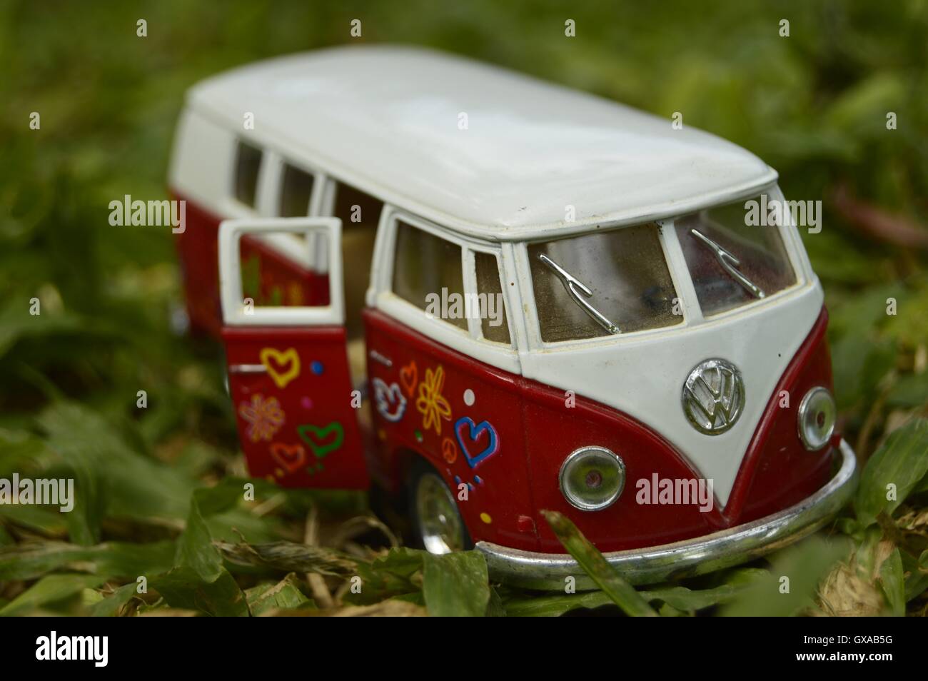 German classic vans, toy on rocky terrain. red and white van in barren ...