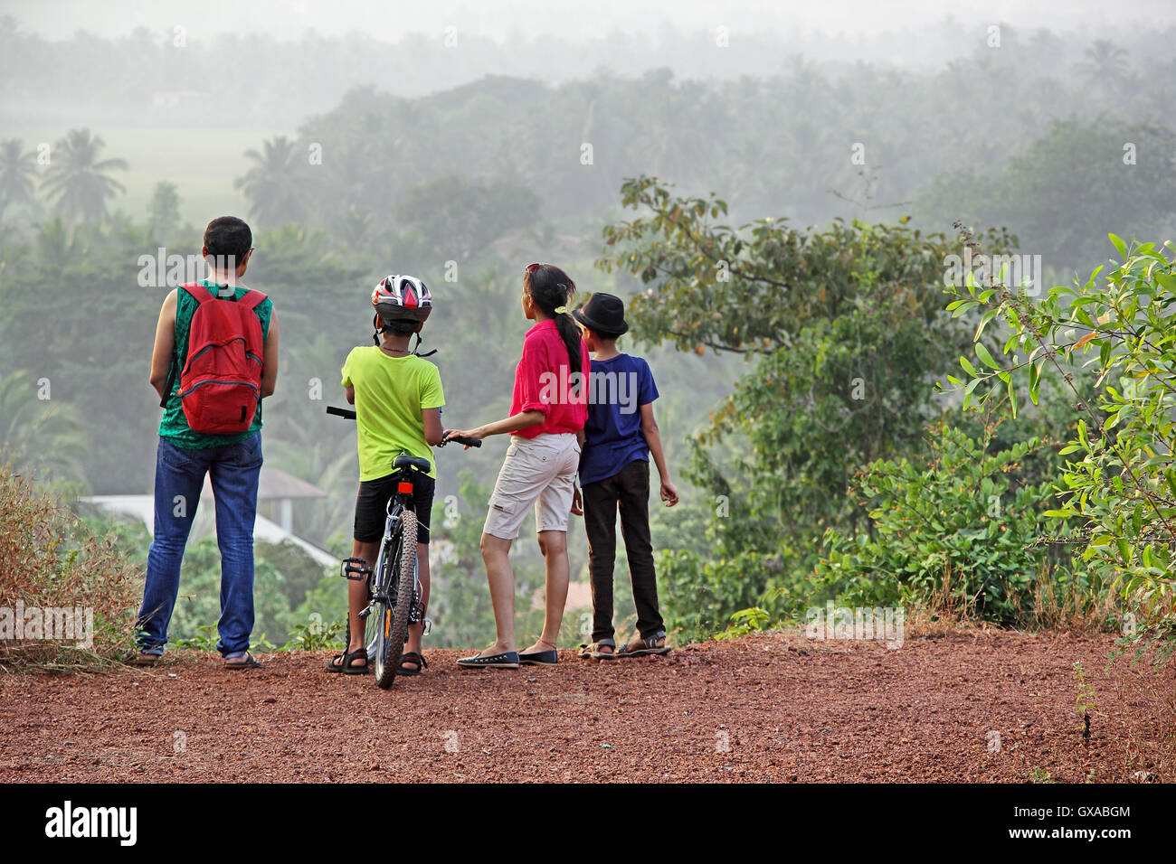 Group of trekking and cycling enthusiasts pausing to appreciate the ...