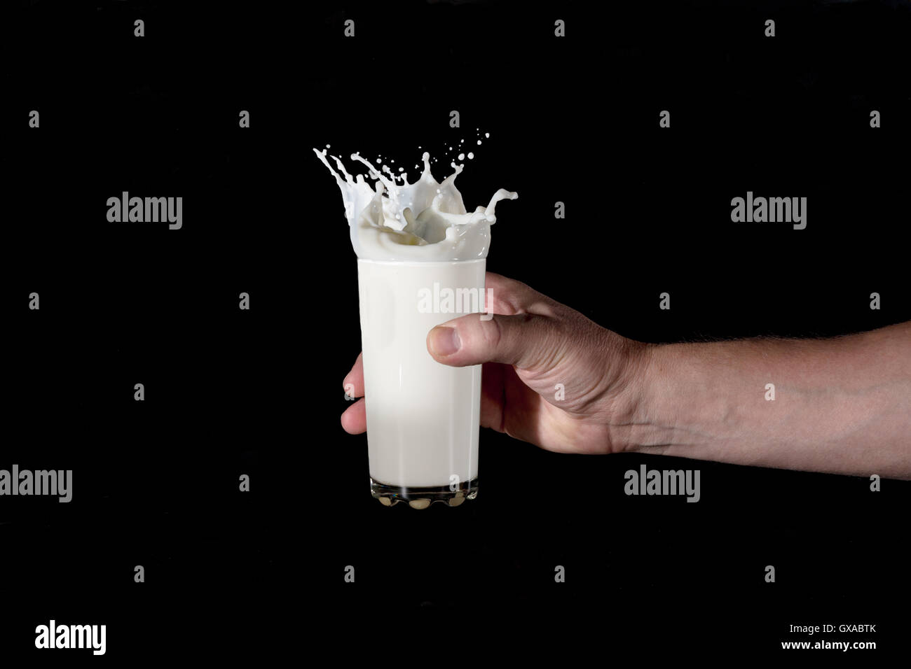 Milk pouring black background hi-res stock photography and images - Alamy