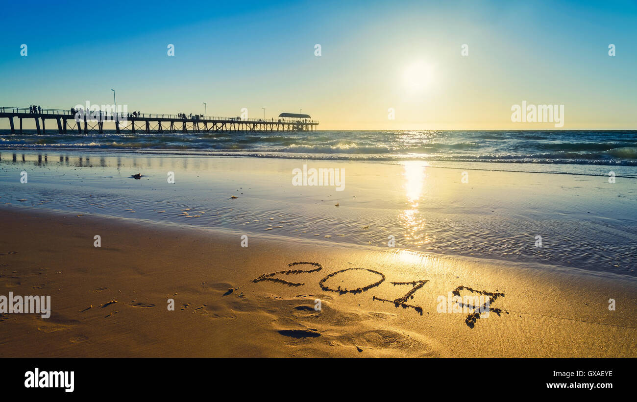New Year 2017 number sign drawn on sand at the beach Stock Photo - Alamy