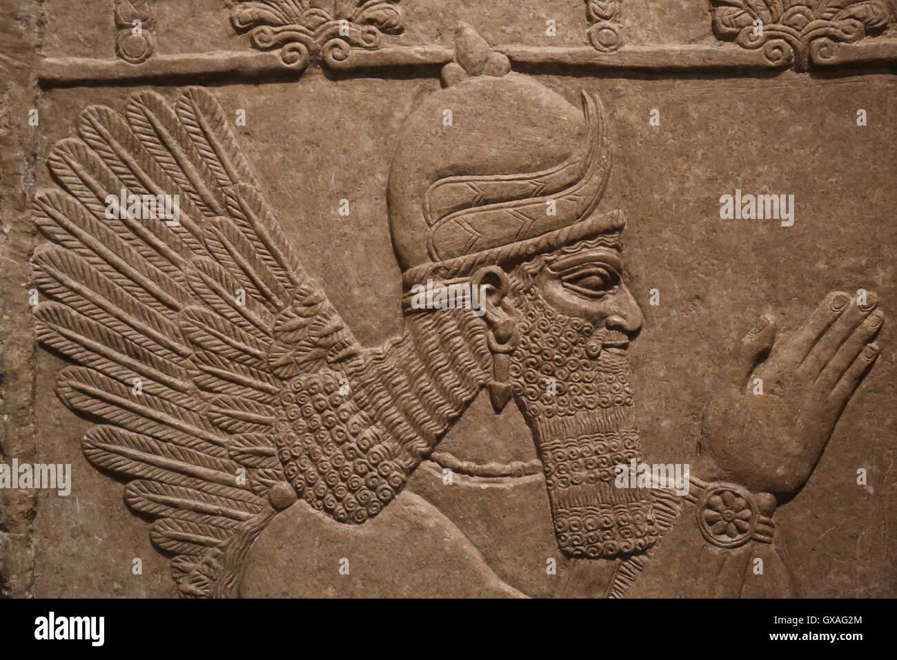 Relief with winded genius. 9th century BC. Neo-Assyrian. Reign of ...