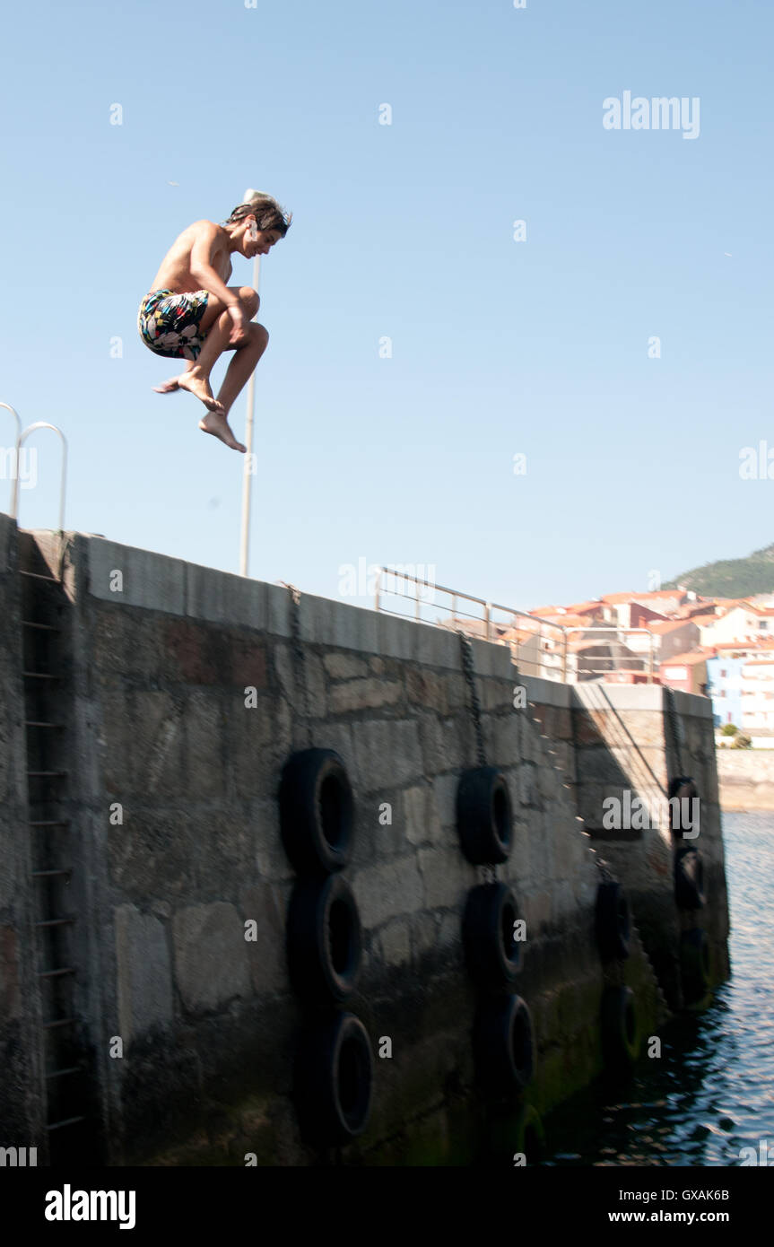 Boy jumping sea spain swimmer summer hi-res stock photography and ...